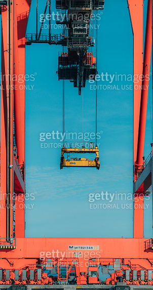 Port Crane at sunset. Harbor container terminal with cranes, containers ...