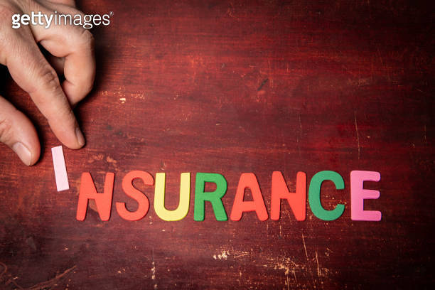 INSURANCE Concept. Colorful text from letters of the alphabet on a ...