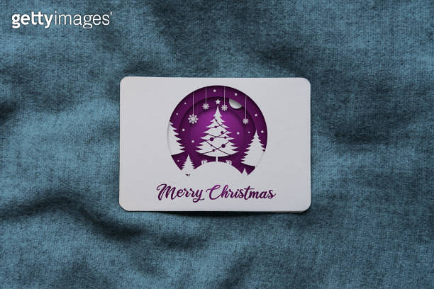 Christmas card with purple coloured paper cut style Christmas tree ...