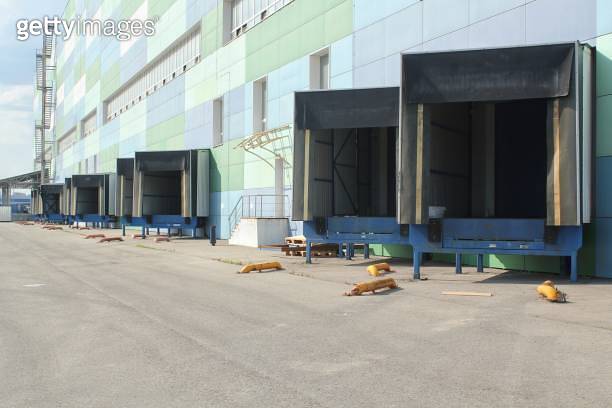 Modern loading docks for trucks. Loading zone in industry building ...