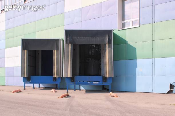 Modern loading docks for trucks. Loading zone in industry building ...