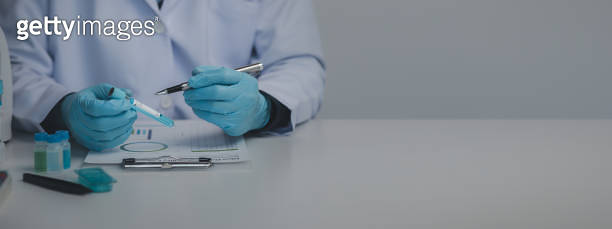 Lab assistant, medical scientist, chemistry researcher holds a glass ...