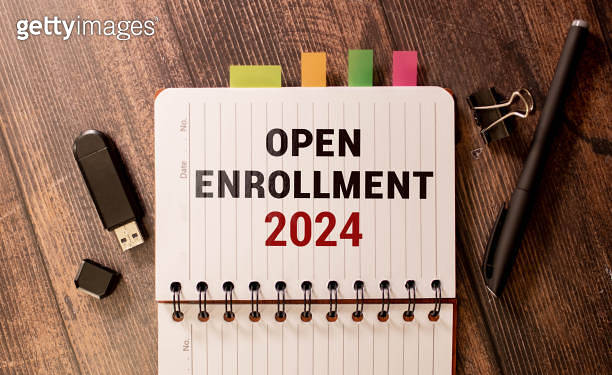 open enrollment 2024. text on a sticker next to money and banknotes ...