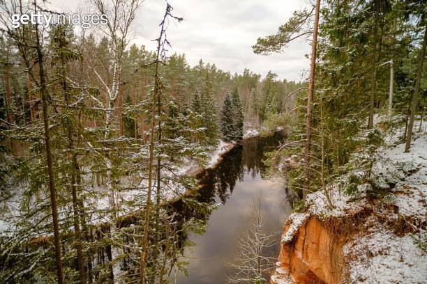 The river Salaca is meandered by high sandstone cliffs. Skanaiskalns ...