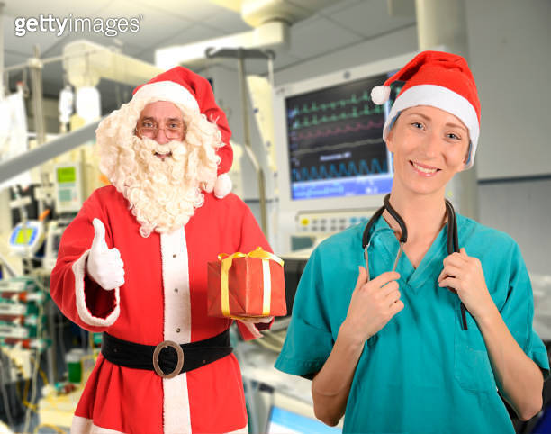Santa Claus and young doctor in hospital 이미지 (1796293417) - 게티이미지뱅크