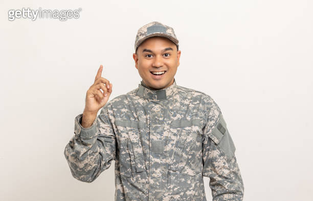 Pointing blank space. Asian man special forces soldier standing in ...