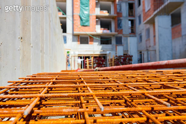 Square rusty armature, installed to strengthen the building under ...