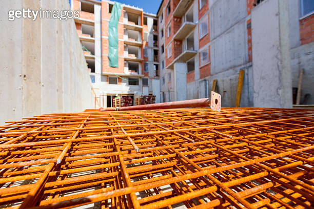 Square rusty armature, installed to strengthen the building under ...