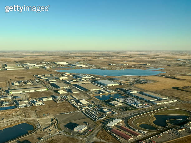 Aerial views of the industrial buildings and ponds on the outskirts of ...