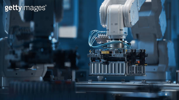 Automotive Battery Module On Automated Production Line With Robot Arms ...