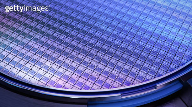 Macro Shot of a Silicon Wafer with Computer Chips during Manufacturing ...