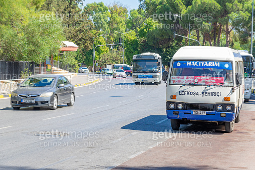 Archaic public transport buses along the border of the capital of ...