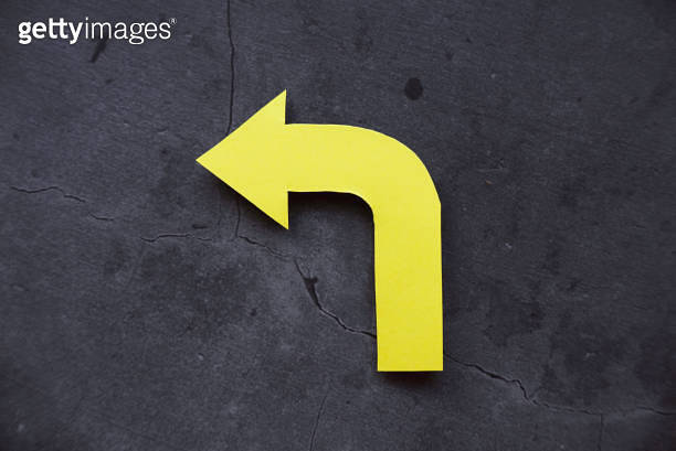 Yellow arrow pathway sign. Future life with direction or obsctacle ...