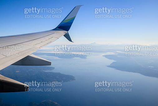 An Alaska Airline airplane flying from Seattle to Anchorage. Aerial ...