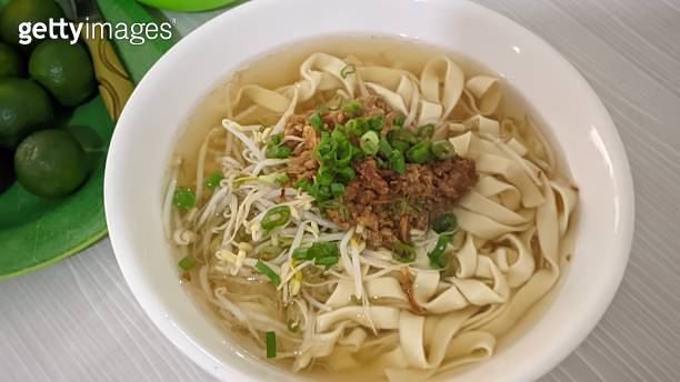 A bowl of Chinese Bakmie Mie Lebar Kuah with a mixture of bean sprouts ...