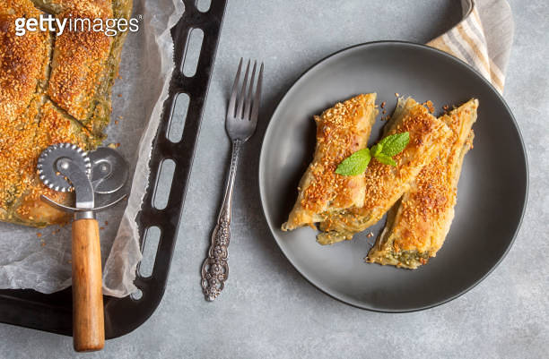 Greek cuisine dishes; spanakopita Sesame on handmade spinach feta ...