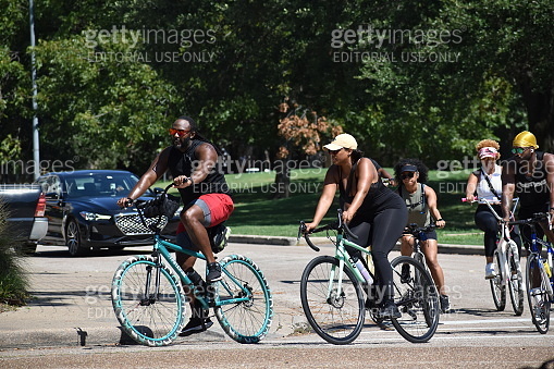 African community bikers take a ride together during a cycling event ...