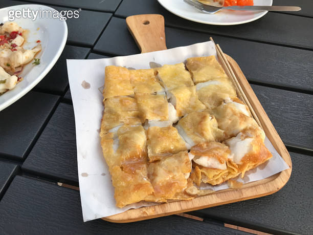 Thai young coconut pancake or Thai roti with young coconut and ...