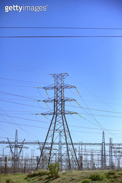 Electricity Pylon Transmission Tower at substation on a sunny clear day ...
