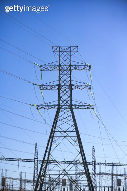 Low Angle view Electricity Pylon Transmission Tower at substation on a ...