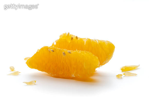 Peeled orange fruit pulp isolated on white background. Macro photo of ...