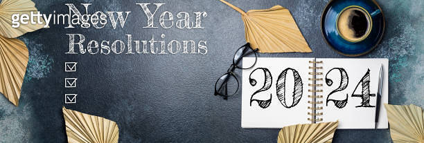 New year resolutions 2024 on desk. 2024 goals list with notebook ...