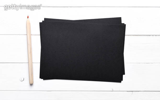 stack of black paper with pencil (1619240397) - 게티이미지뱅크