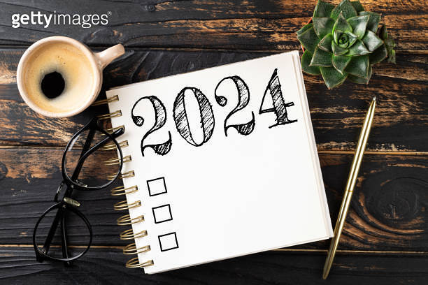 New year resolutions 2024 on desk. 2024 resolutions list with notebook ...