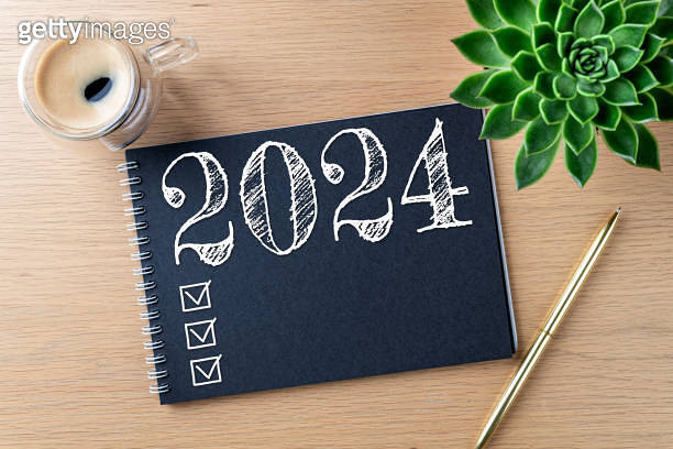 New year resolutions 2024 on desk. 2024 goals list with notebook ...