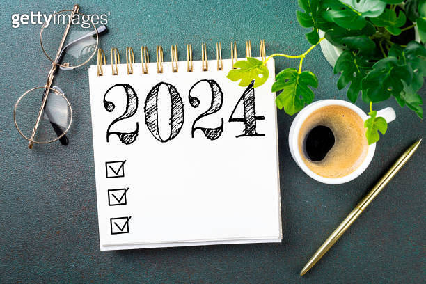 New year resolutions 2024 on desk. 2024 resolutions list with notebook ...