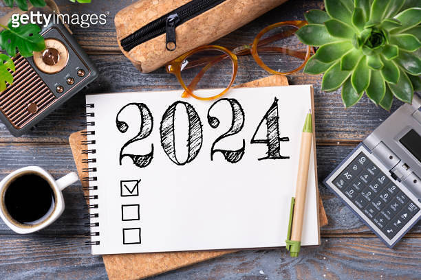 New year resolutions 2024 on desk. 2024 goals list with notebook ...