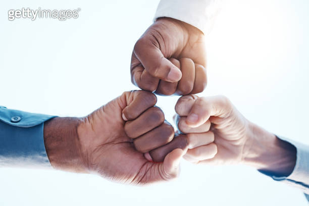 Fist bump, group support and team success in meeting at work ...
