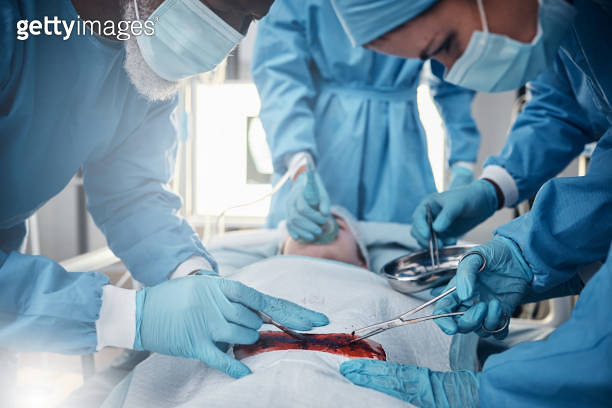 Doctors, nurses or surgery hands on cut patient in hospital emergency ...