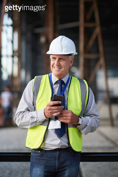 Construction, engineer and man with phone thinking outdoor about ...