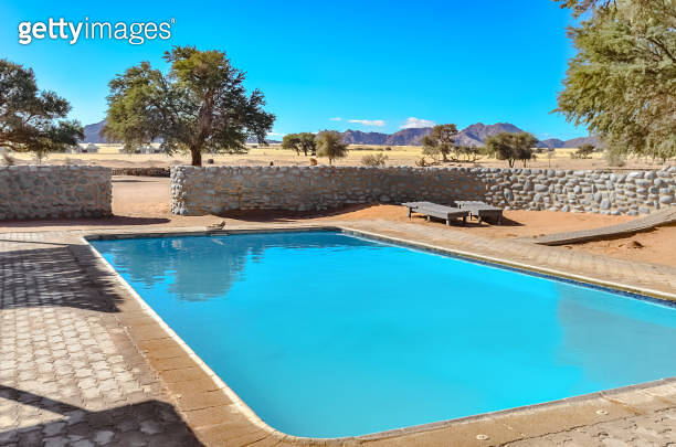 Swimming pool in luxury safari lodge camp in african savannah nature ...