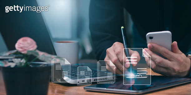 Businessman uses a stylus pen to sign documents with an electronic ...