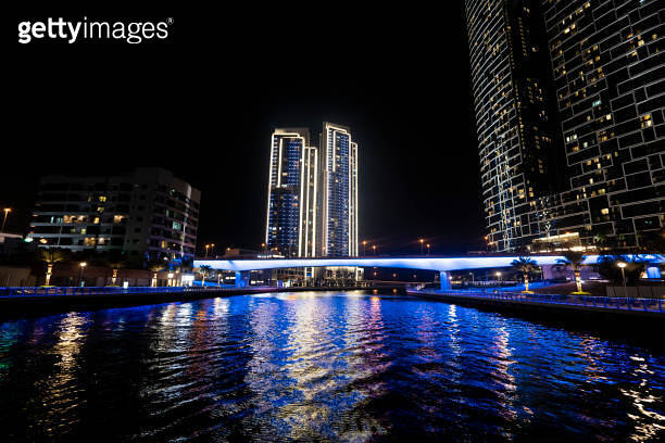 beautiful night view of dubai marina skyscrapers from the water side on ...