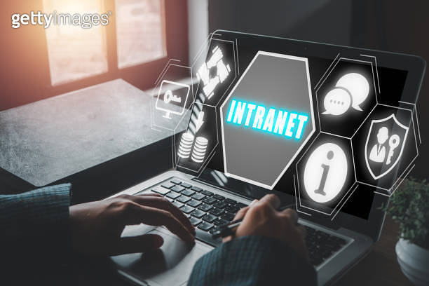 Intranet concept, Business woman using laptop computer on office desk ...