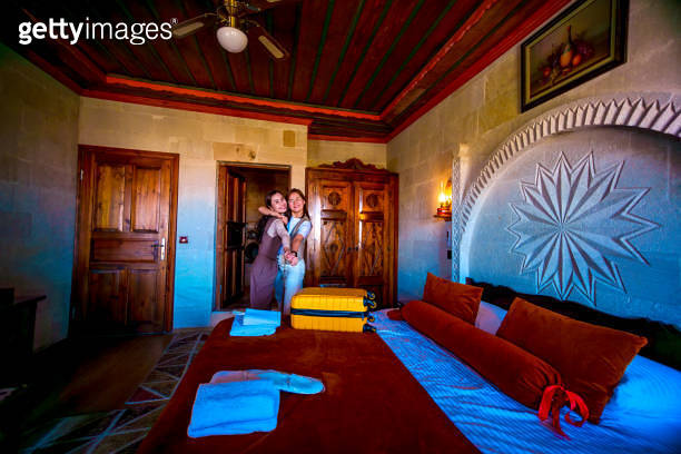 Tourist Women Entering Hotel Room, Dancing and Embracing each other 이미지 ...