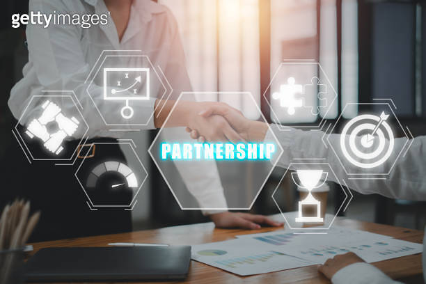Partnership concept, Photo two coworkers handshaking process with ...