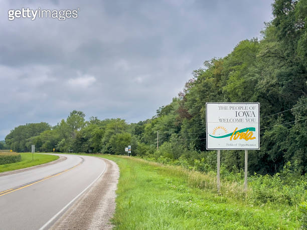 Iowa welcome roadside sign at state border with Nebraska, summer ...