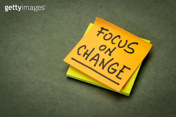 focus on change inspirational advice - handwriting on a sticky note ...