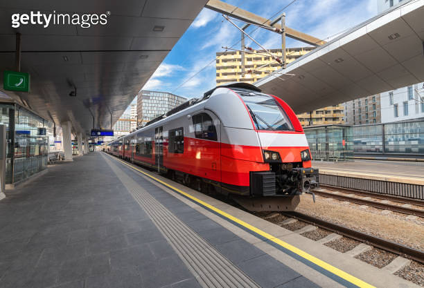 High speed train on the train station at sunset in Vienna, Austria ...