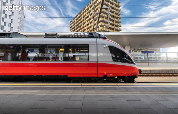 High speed train on the train station at sunset in Vienna, Austria ...