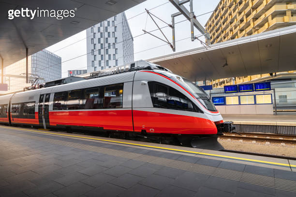 High speed train on the train station at sunset in Vienna, Austria ...
