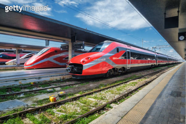 High speed trains on the train station at sunny day Venice, Italy ...