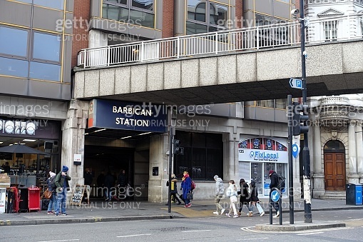 Entrance to Barbican tube station and pedestrian bridge to Barbican ...