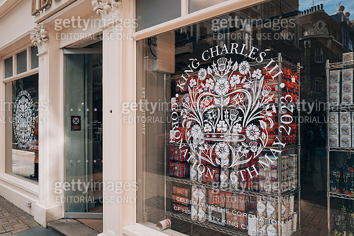 Sign celebrating coronation of King Charles III in the window of ...