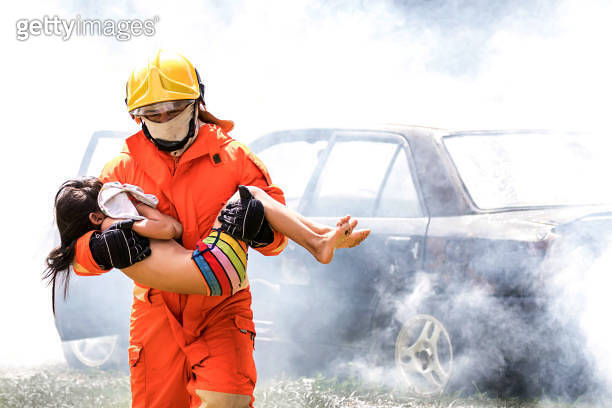 Firefighter to save girl in fire and smoke. Rescue Team or Firefighters ...