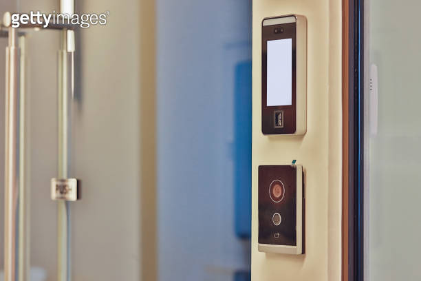 A face scanner to unlock door in office building. Access control facial ...